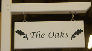Wooden Posts, Oak Posts, Wrought Iron Bracket | The Sign Maker